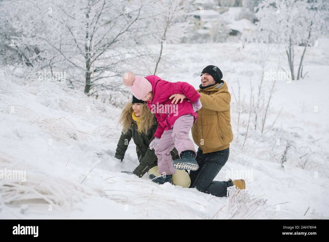 family spends time together in the winter Stock Photo - Alamy