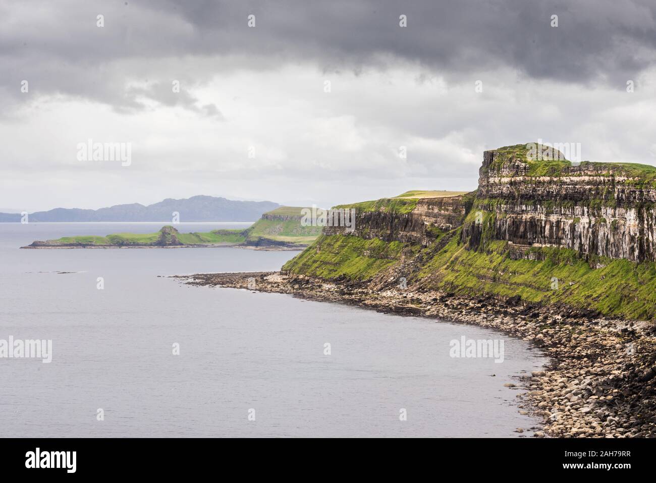 Scottish landscape with a shore covered with pebbles, the Kilt Rock ...