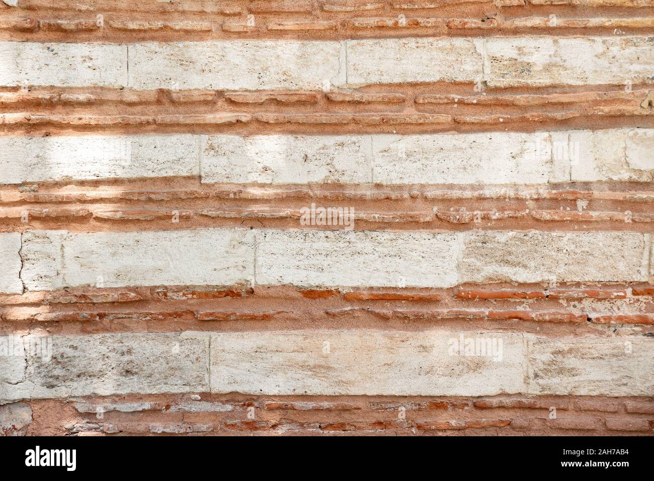 background of stone wall with red stripes, texture Stock Photo - Alamy