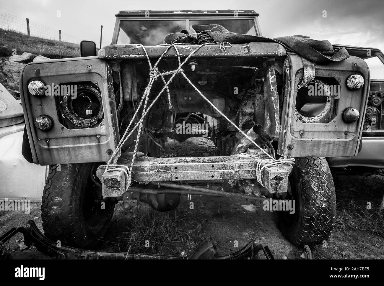 Black and white close up of an old and wrecked 4x4 car missing the ...