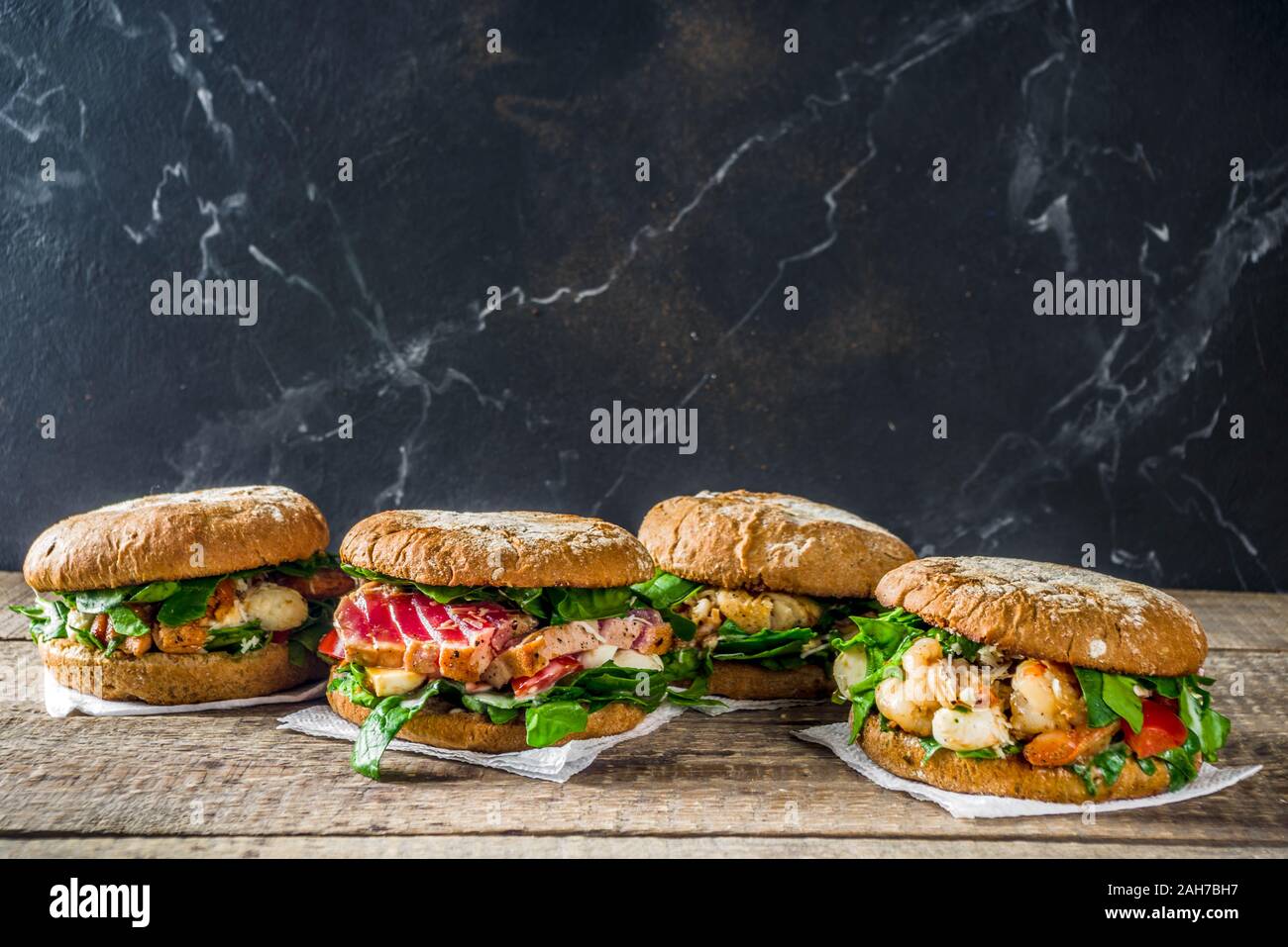 Various seafood and fish burgers assortment. Homemade healthy burger ...