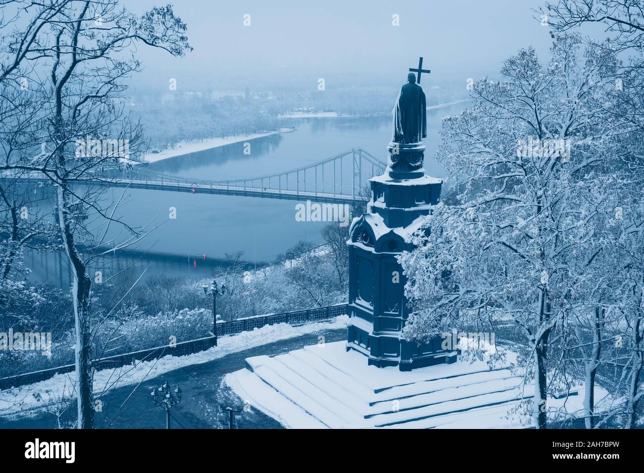 Illuminated bronze statue of Saint Volodymyr in winter Kyiv. Frosted ...