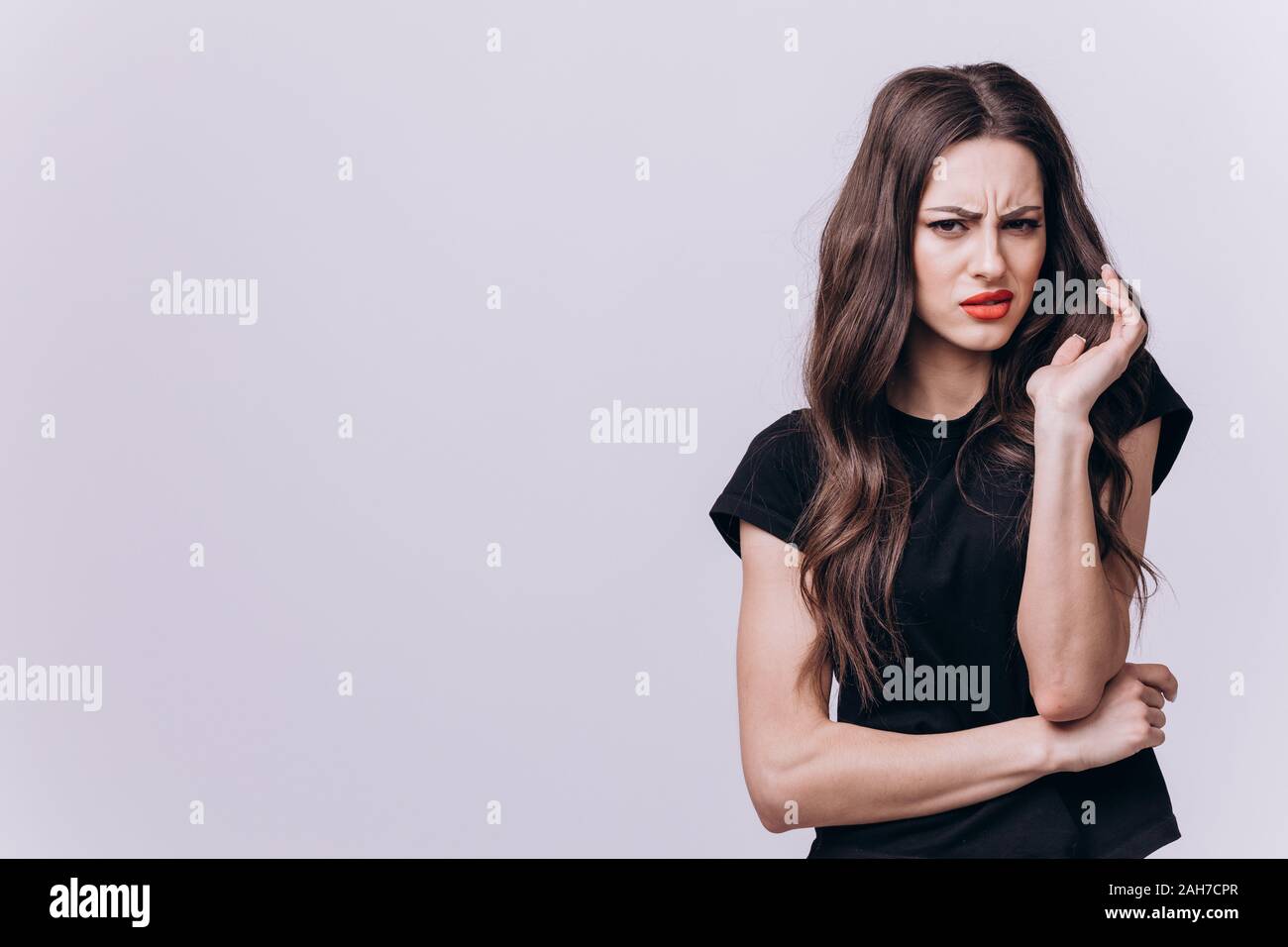 Displeased cute brunette girl showing incomprehension and disgust ...