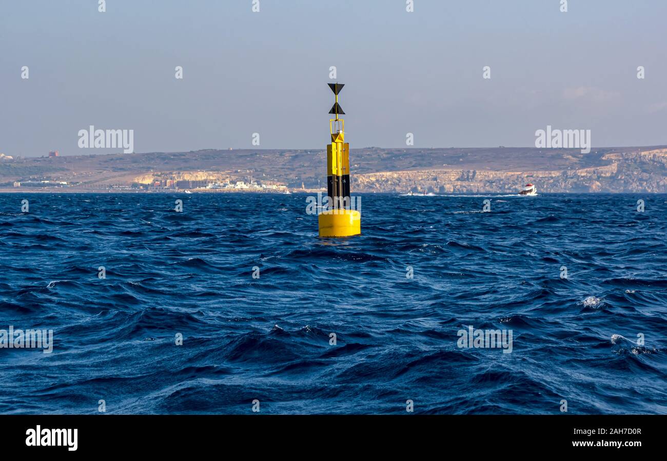 Navigational floating buoy - West cardinal mark - in Mediterranean sea ...