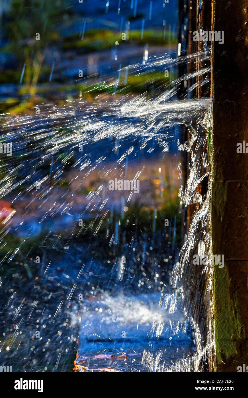 Water sprayed from a leak Stock Photo - Alamy