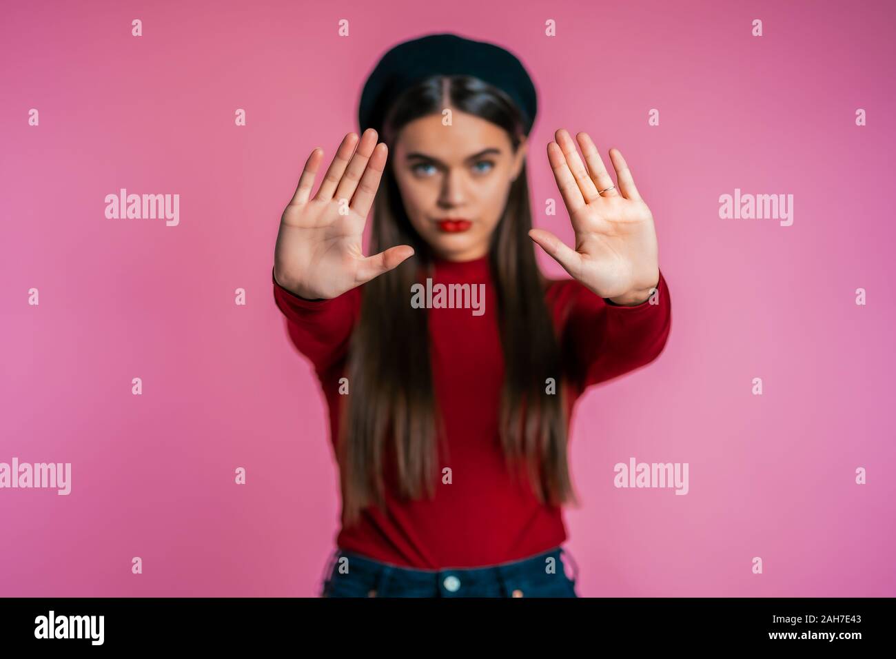 Angry young woman raising hand hi-res stock photography and images - Alamy