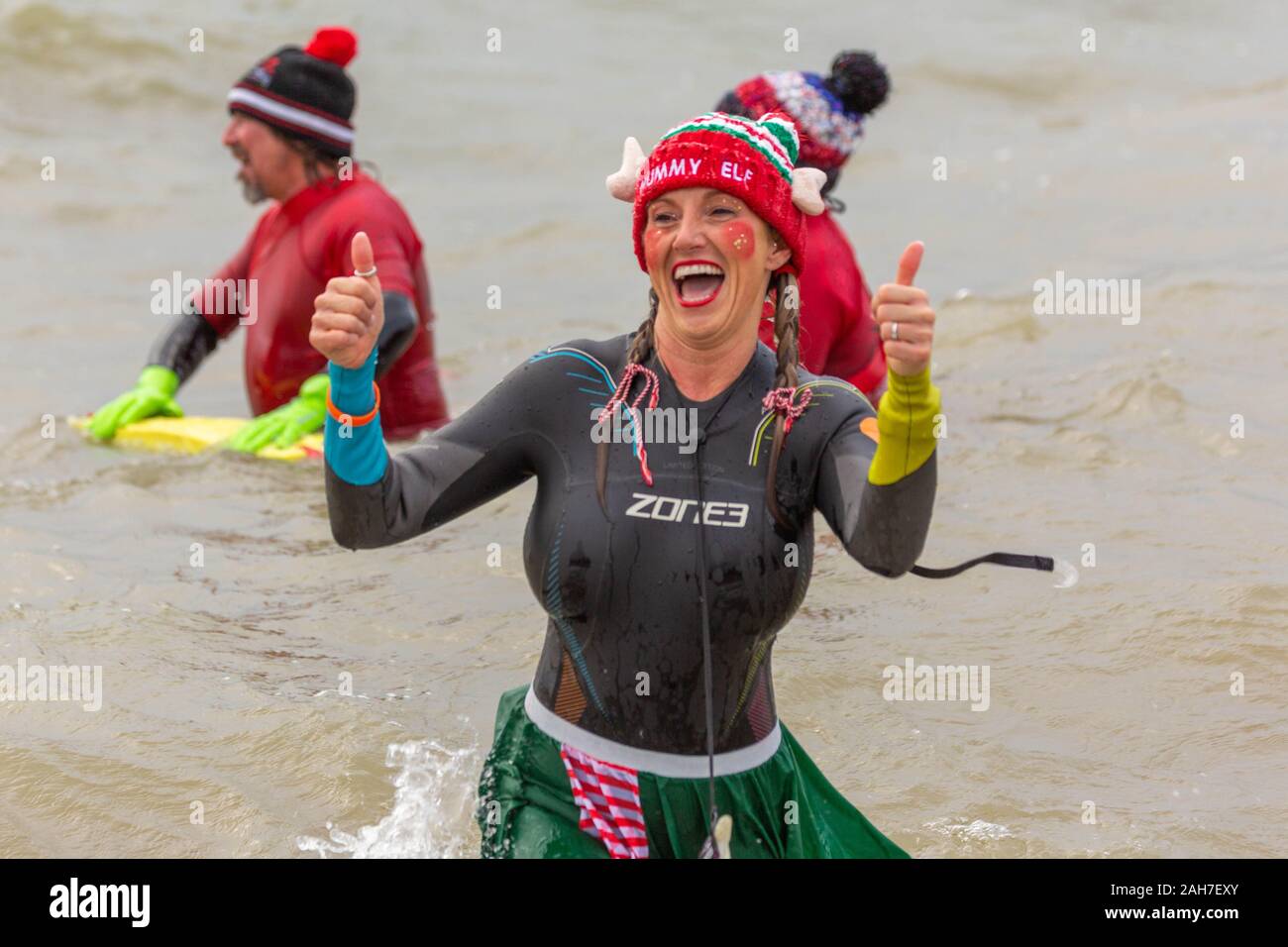 Jubilee Beach, Southend-on-Sea, UK. 26th Dec, 2019. A smiling charity ...