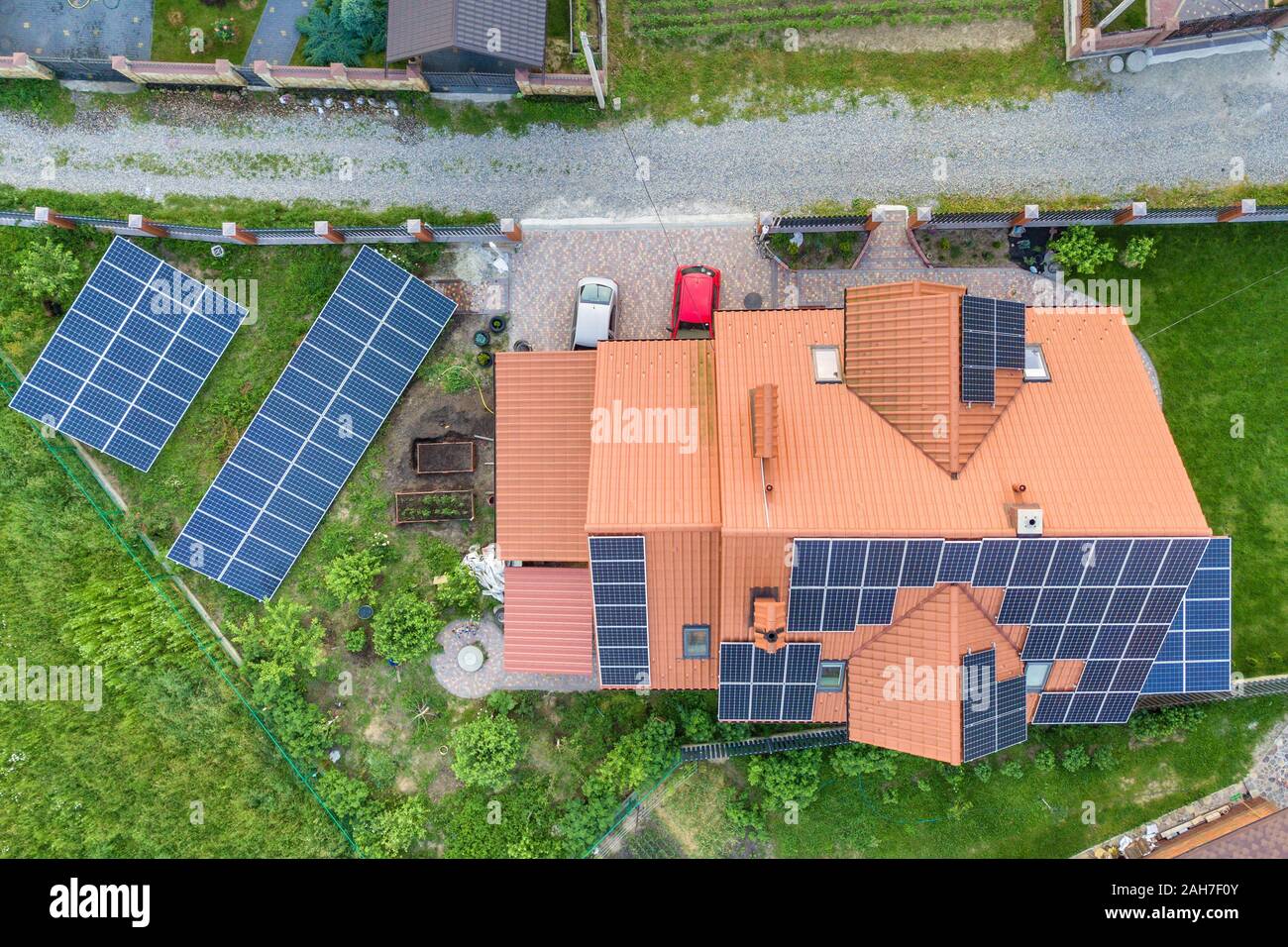Aerial top view of new modern residential house cottage with blue shiny ...