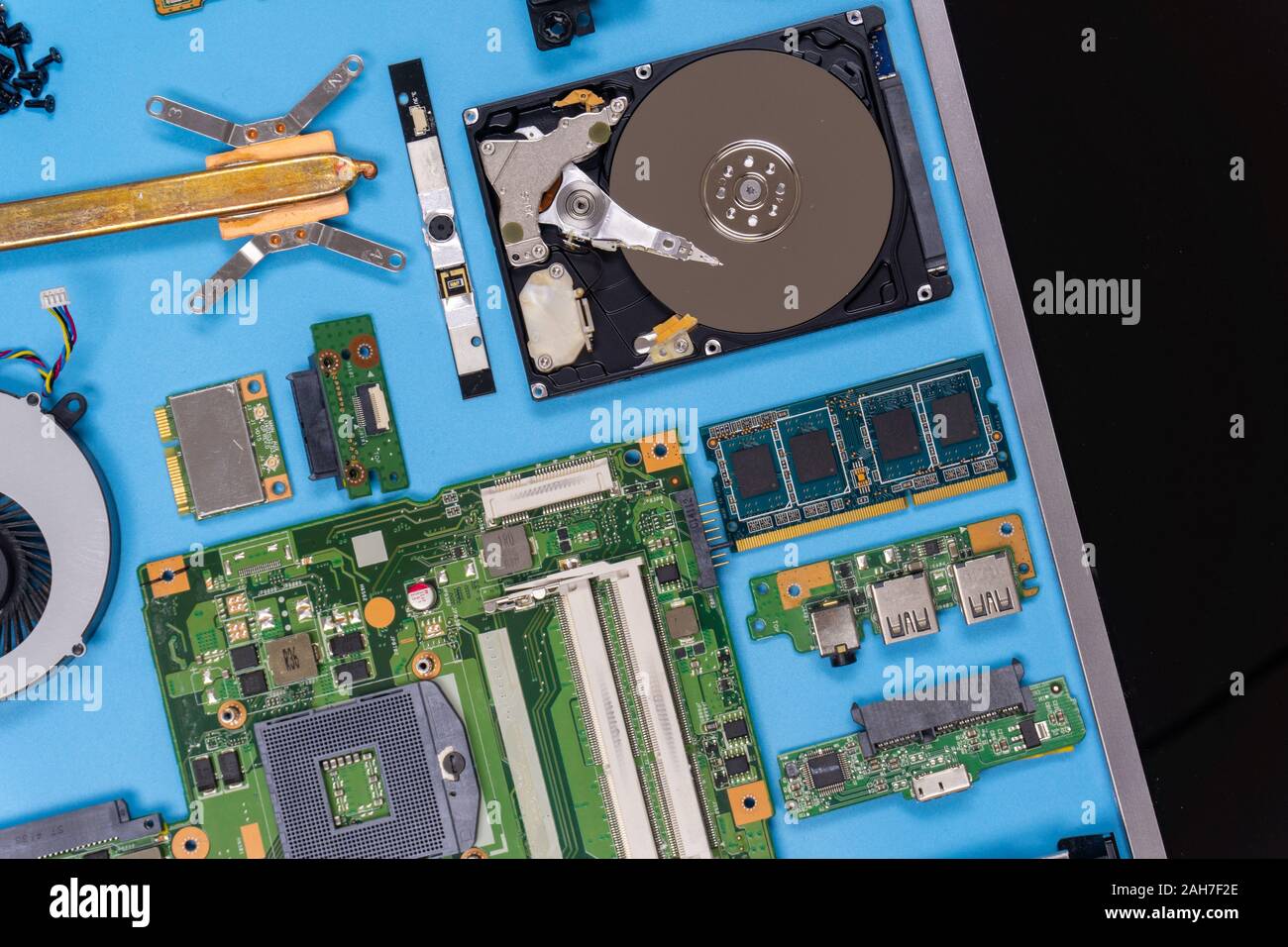Parts of a modern computer. The insides of a laptop on a blue ...