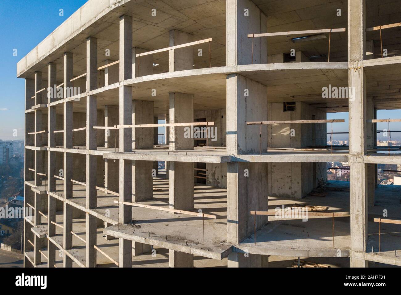 Aerial view of concrete frame of tall apartment building under ...