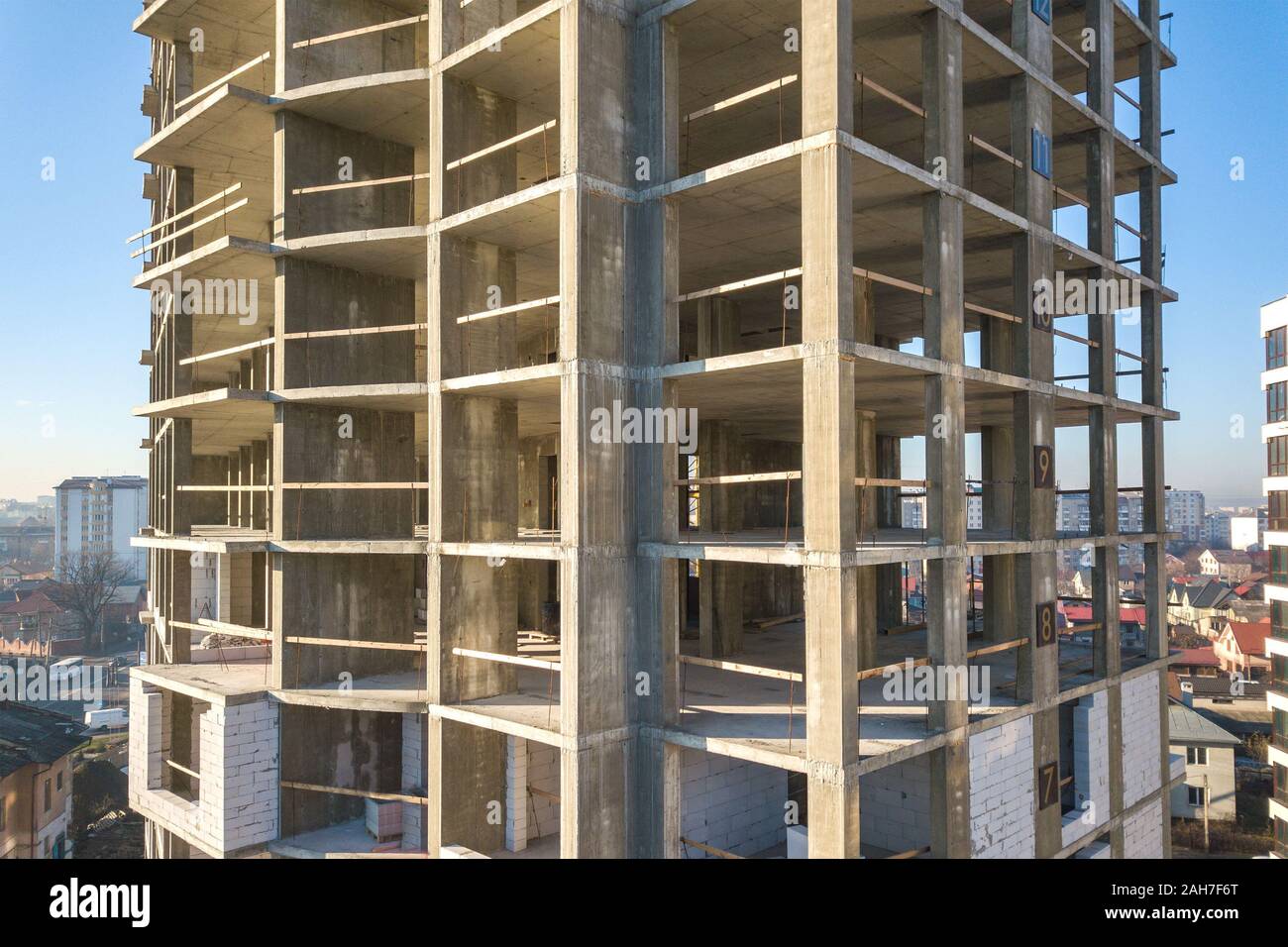 Aerial view of concrete frame of tall apartment building under ...