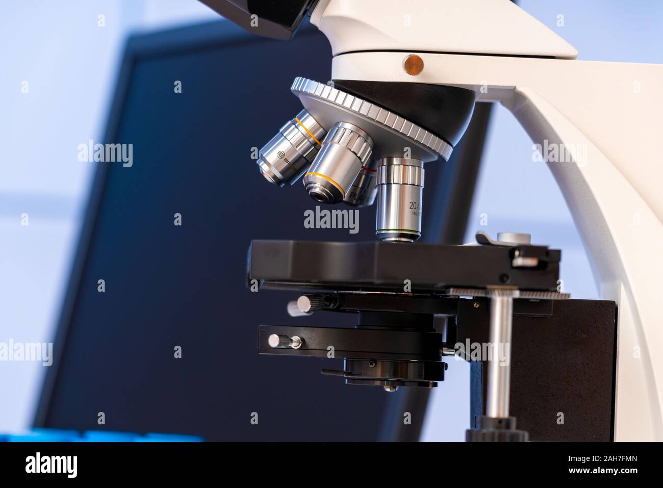 Scientific experiment in microbiological lab. Microscope and test tube ...