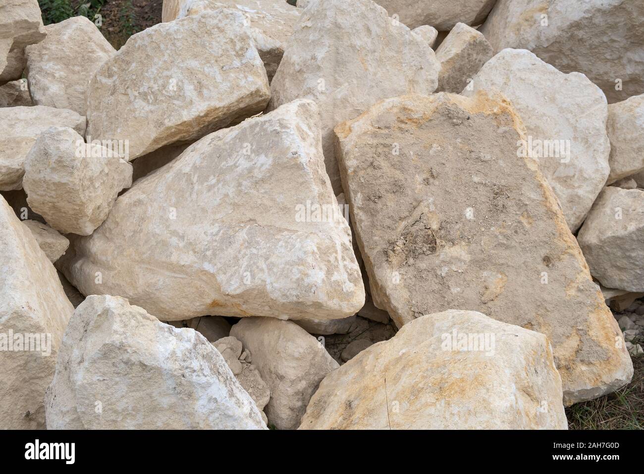 Big pile of large sand stones laying on the ground of construction site ...