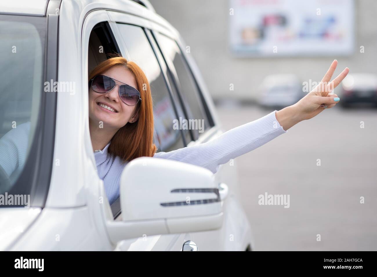 Woman and driver waving hi-res stock photography and images - Alamy