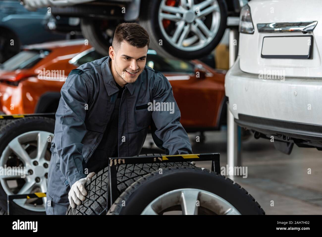 Professional auto mechanic holding new hi-res stock photography and ...