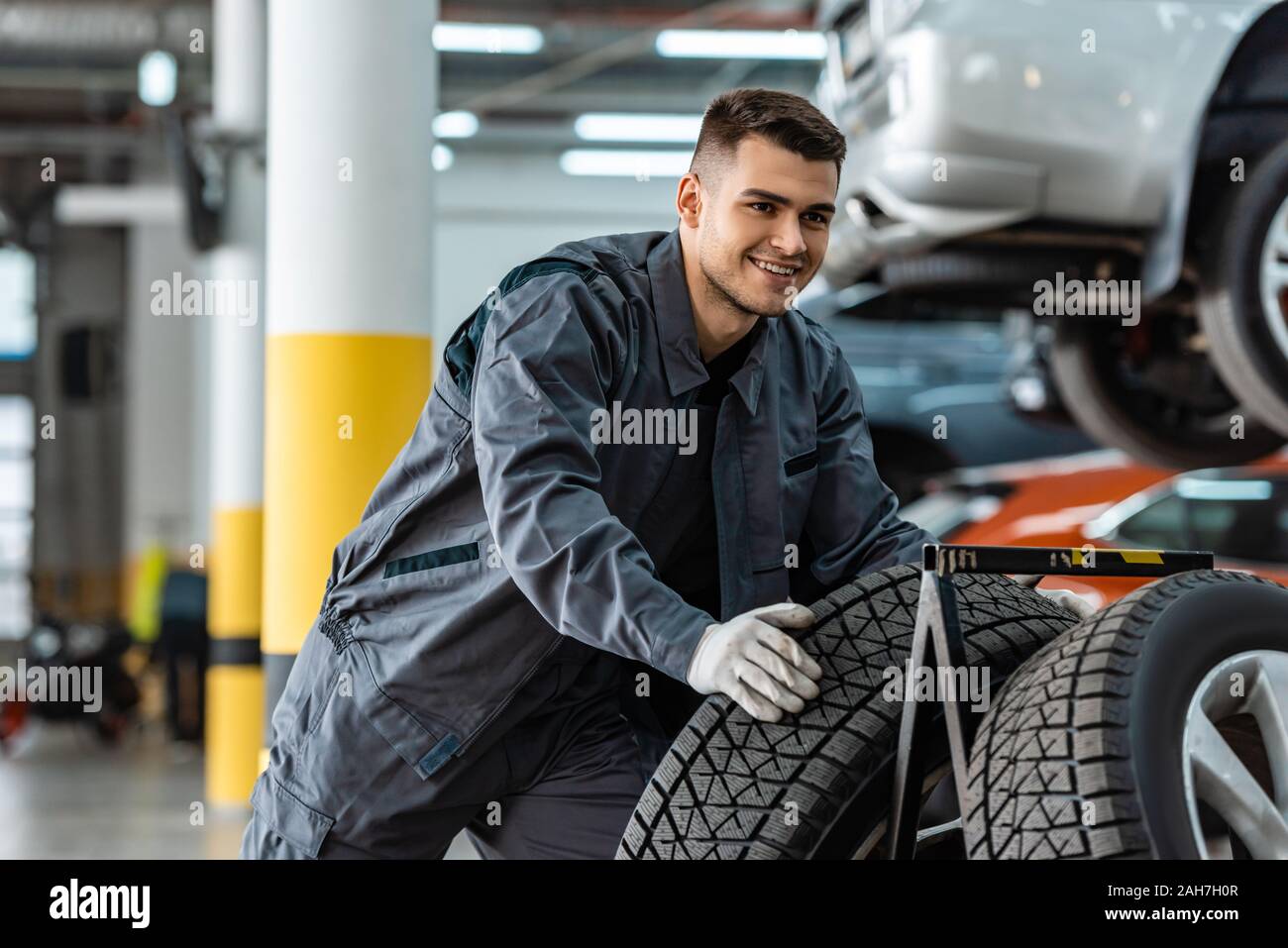 Professional auto mechanic holding new hi-res stock photography and ...