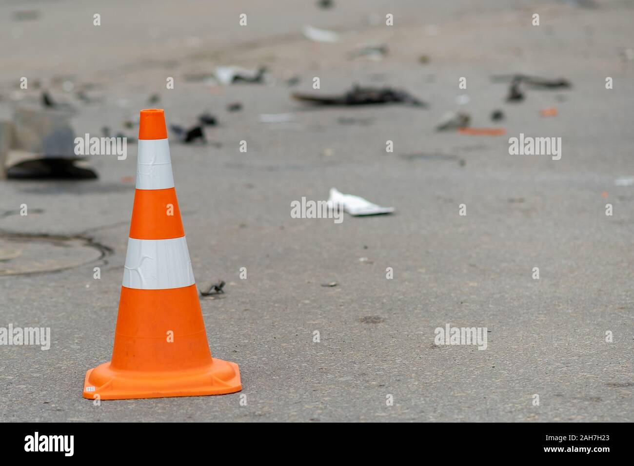 Yellow plastic cone placed on a street at car accident crash site Stock ...