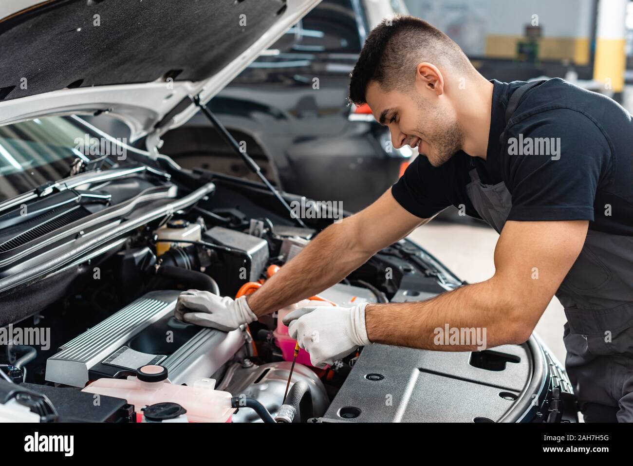 Mechanic checking engine hi-res stock photography and images - Alamy