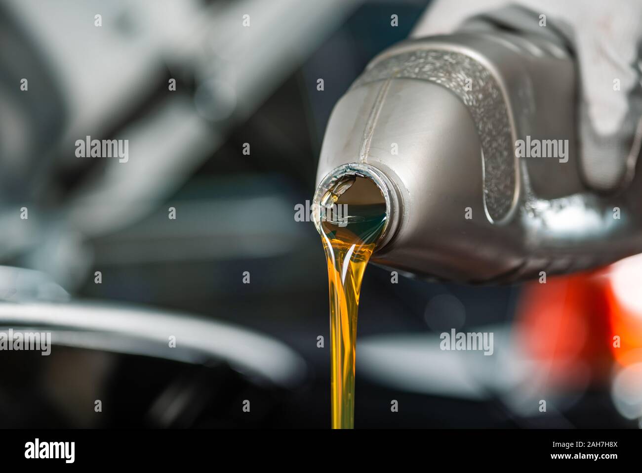 Man pouring oil from bottle hi-res stock photography and images - Alamy