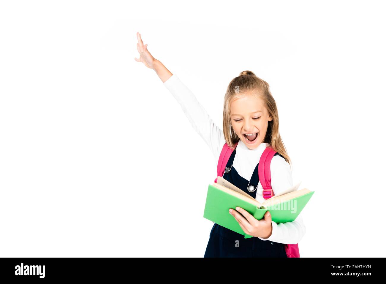 excited schoolgirl showing yes gesture while reading book isolated on ...