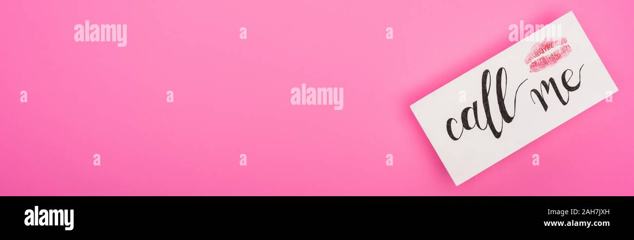 top view of card with lip print and call me lettering isolated on pink ...