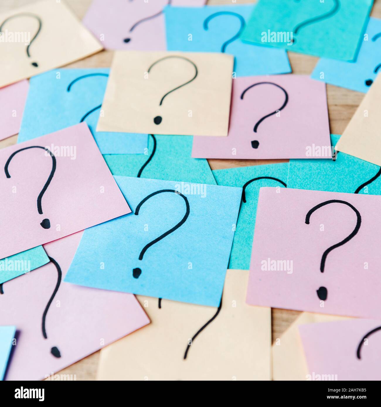 close up of question marks on colorful sticky notes Stock Photo - Alamy