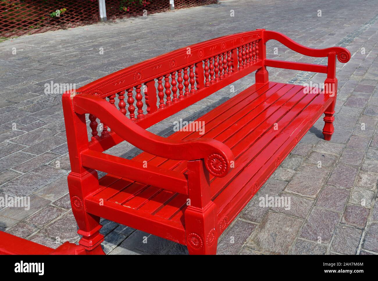 Red wooden bench outdoors in Doha, Qatar Stock Photo - Alamy