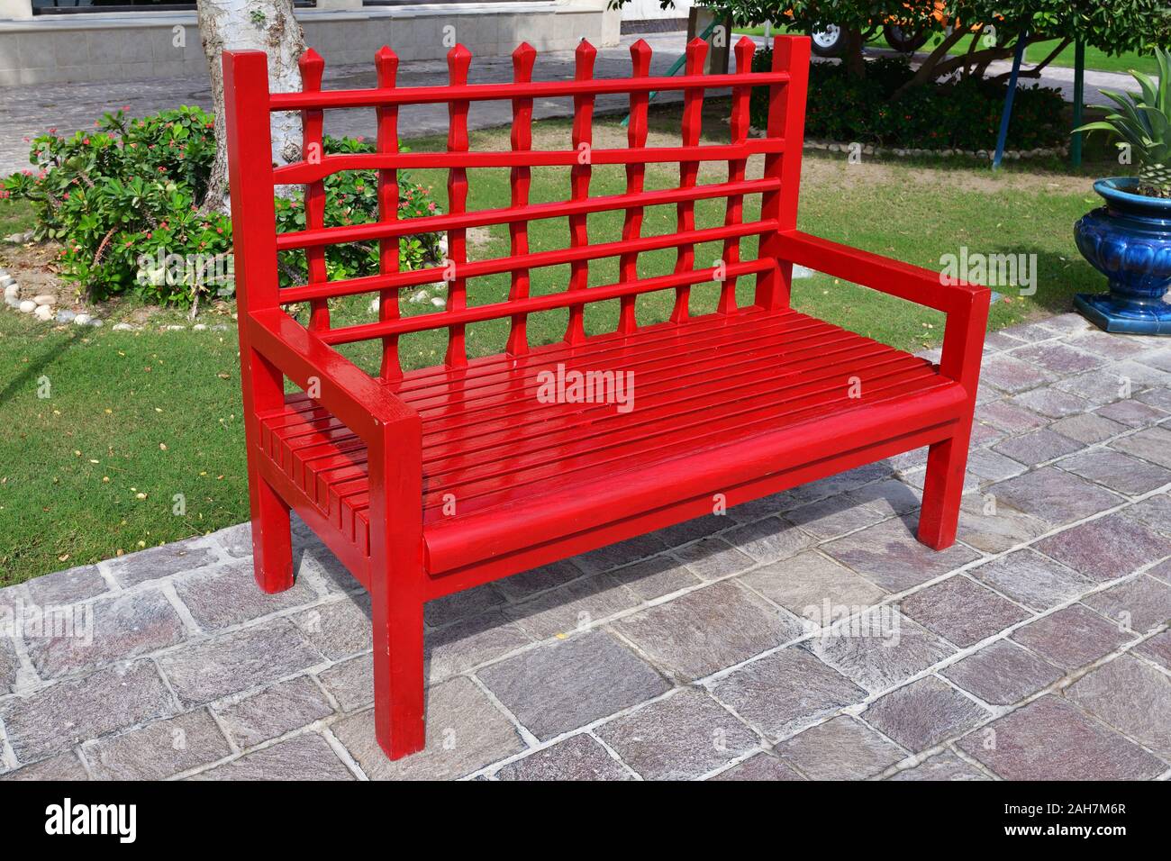 Red wooden bench outdoors in Doha, Qatar Stock Photo - Alamy