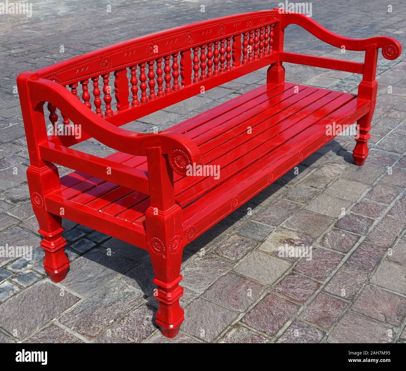 Red wooden bench outdoors in Doha, Qatar Stock Photo - Alamy