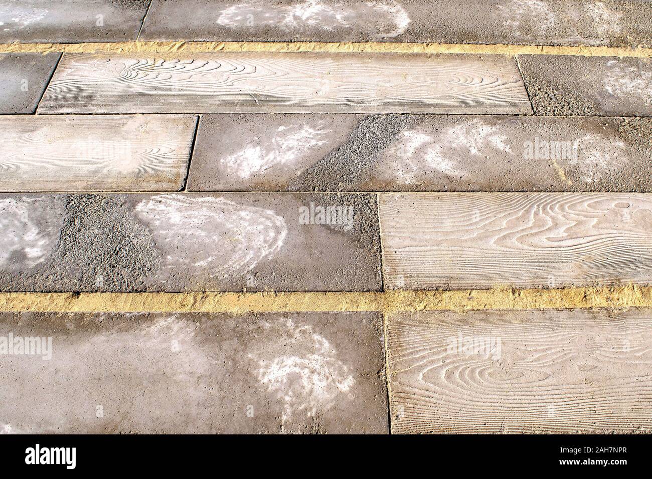 Colorful mixed background made of stoned blocks, wooden boards and sand ...