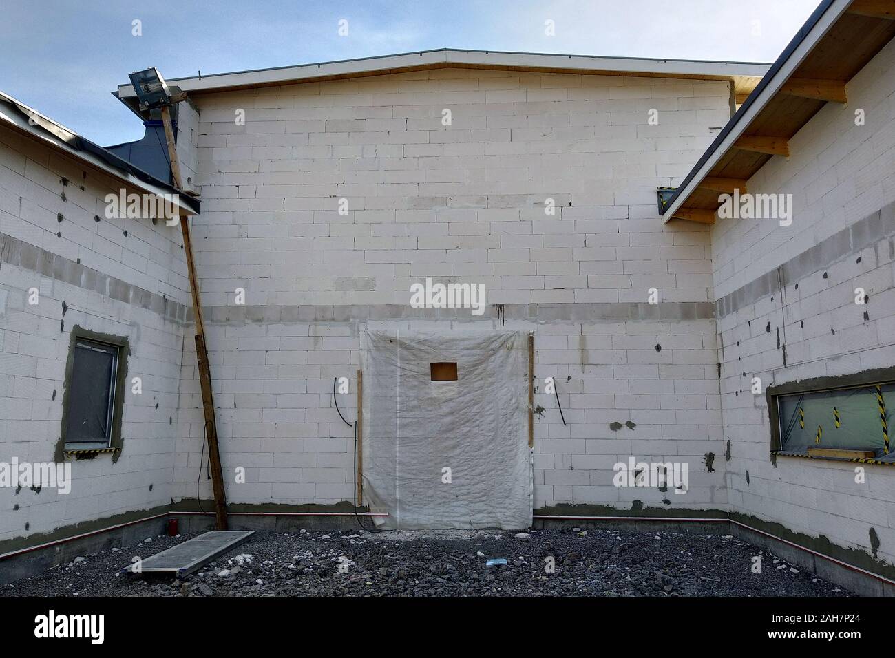 Facade of white block building under construction works Stock Photo - Alamy