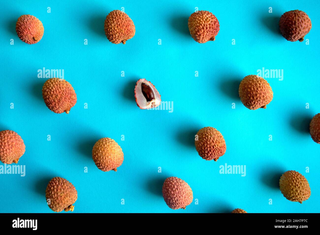Lychee pattern on blue background. Lychee fruits flat lay, top view ...