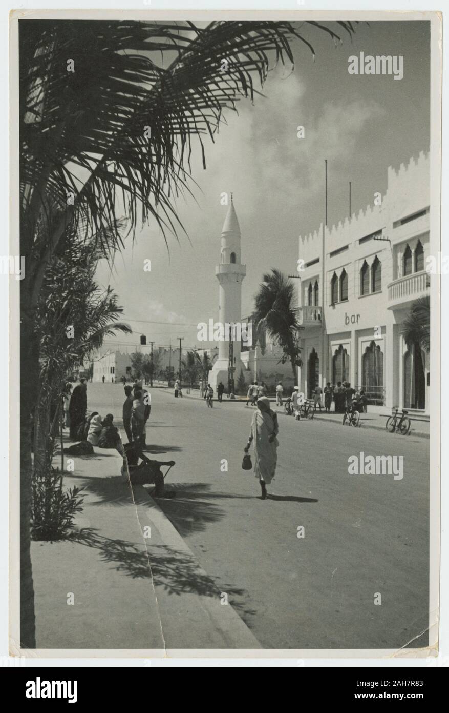 Somalia, Street scene in Mogadishu, showing people and bicycles with a ...
