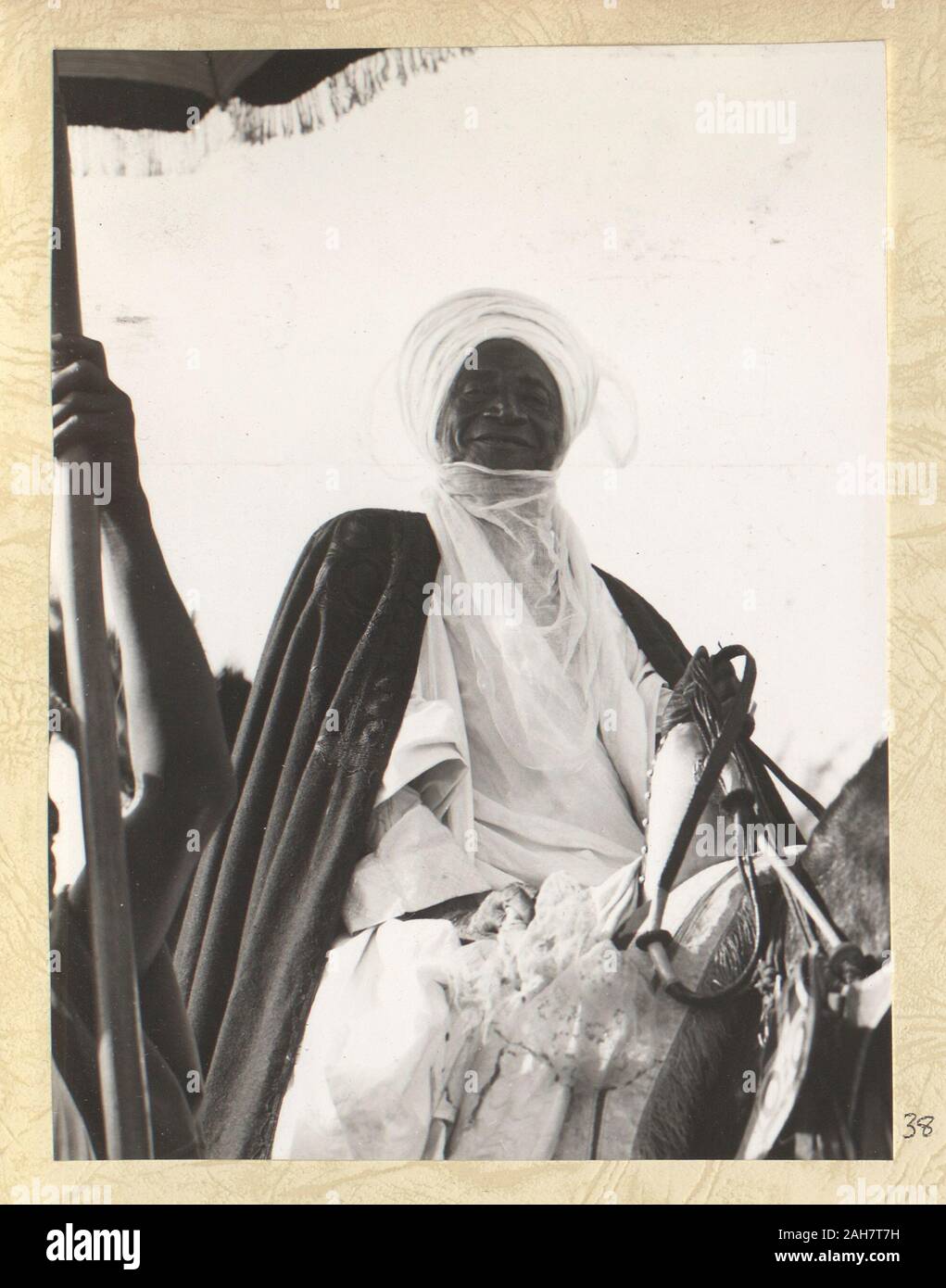 Nigeria, Emir posing for photograph seated on a horse. Caption reads ...
