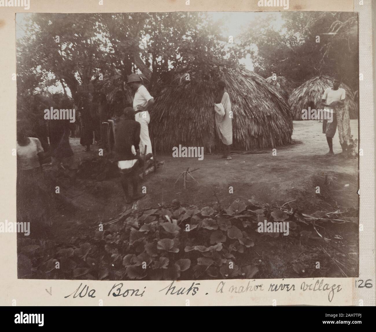 SomaliaJubaland, View of round huts with Somalian villagers and a ...