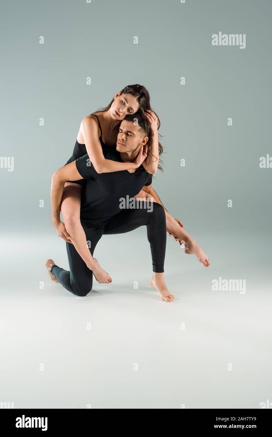 dancers with closed eyes dancing contemporary on grey background Stock ...