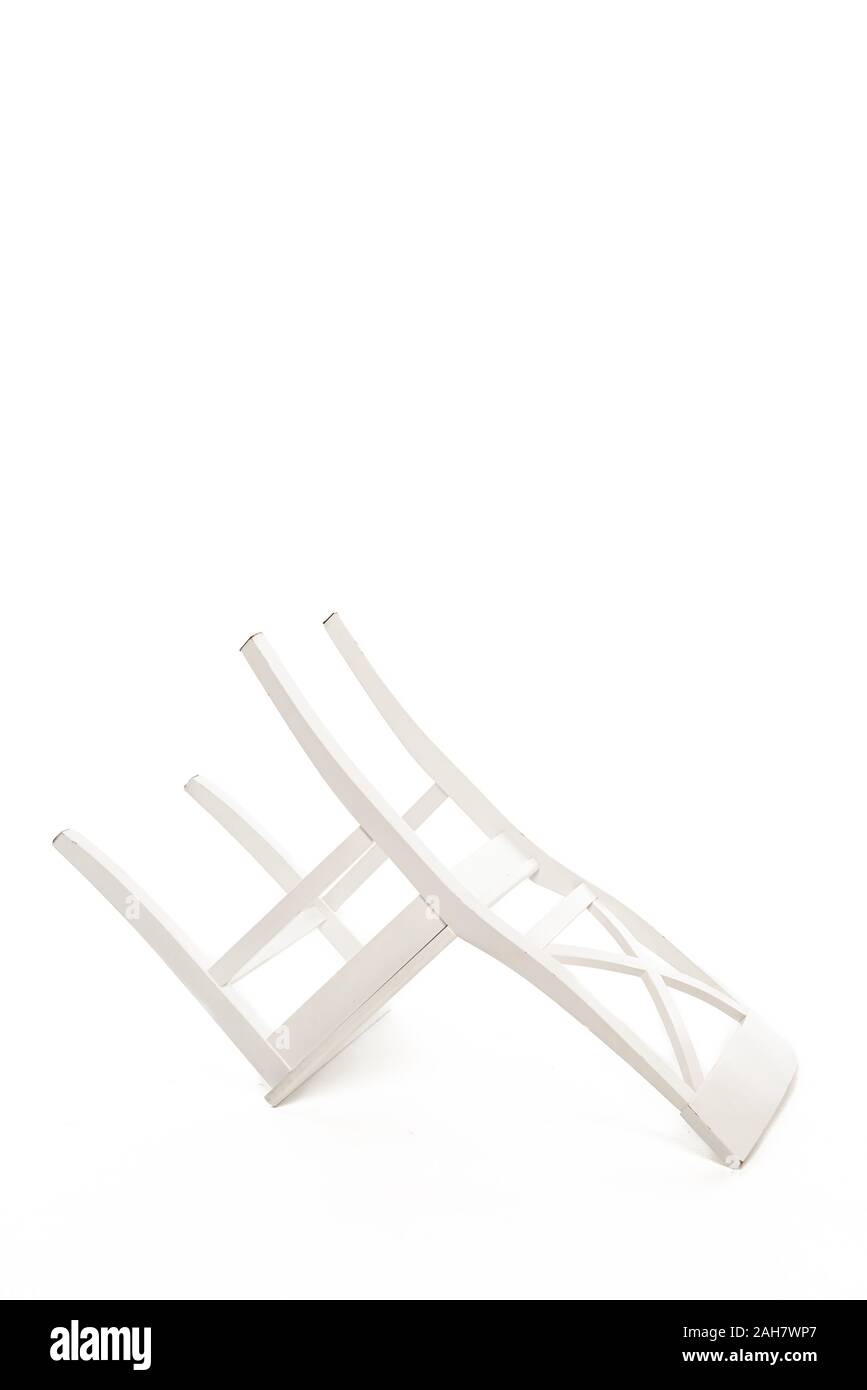 Inverted white wooden chair isolated on white Stock Photo - Alamy
