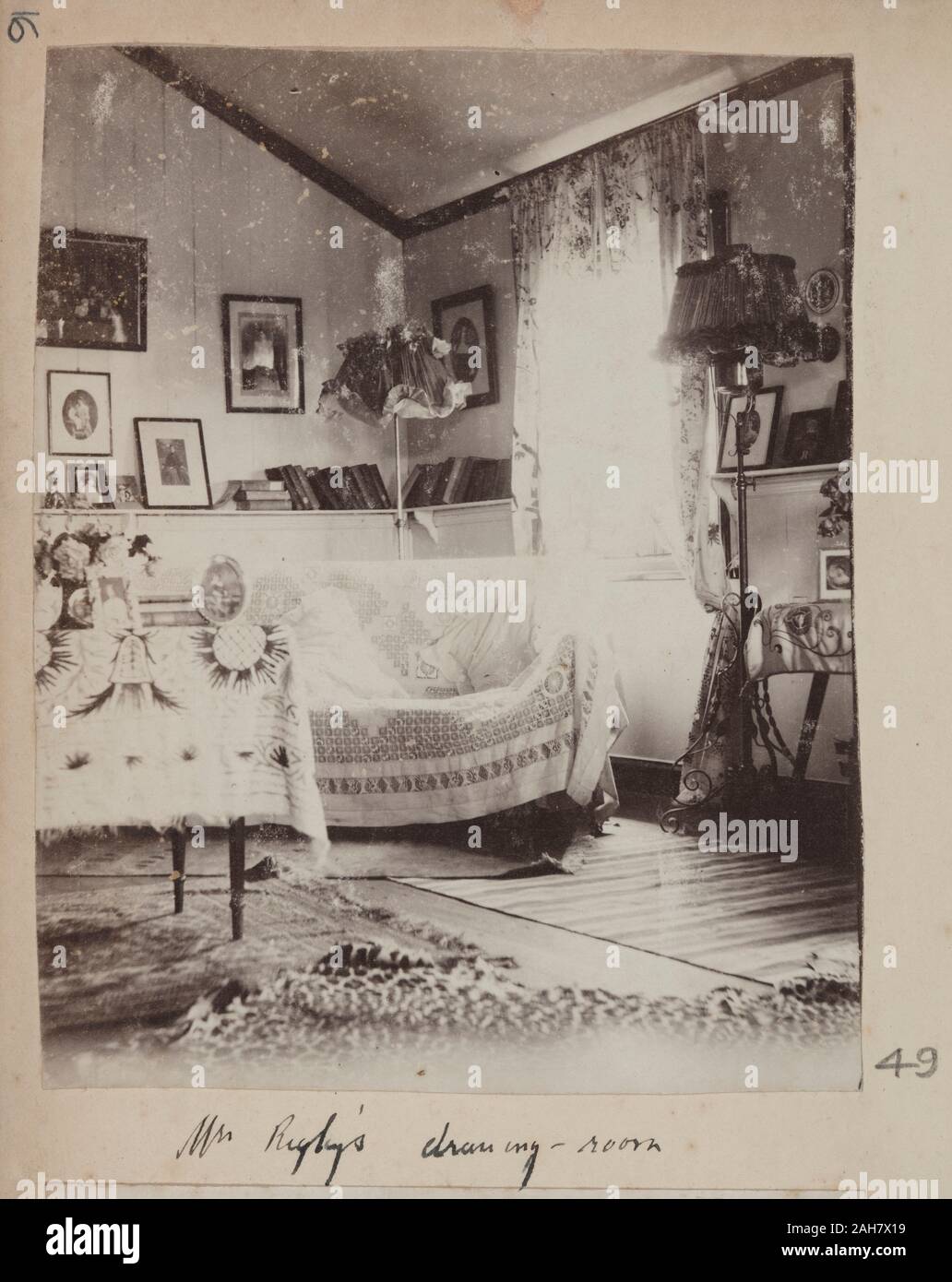 Kenya, Corner of room with sofa, lamps and photographsOriginal ...