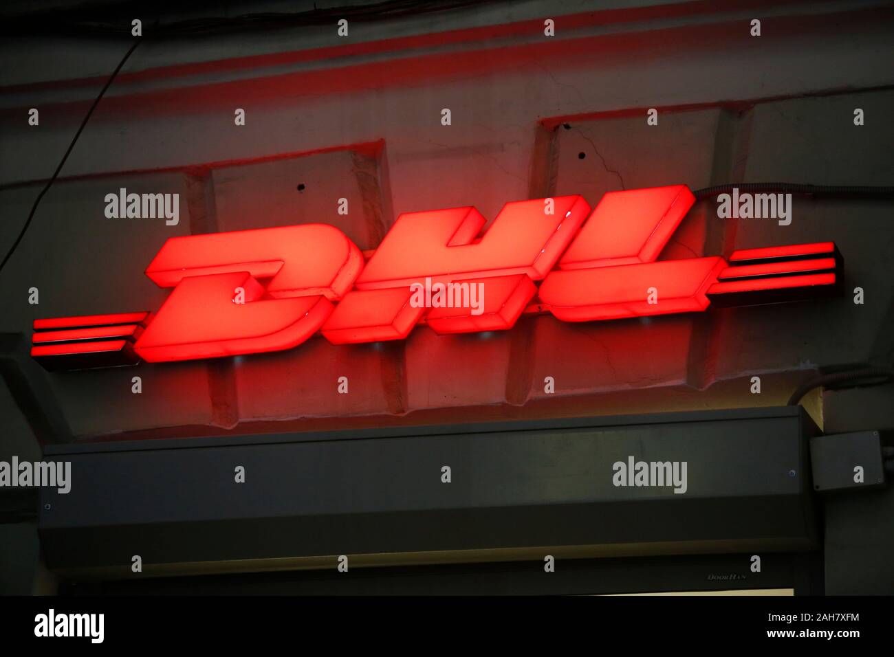 An international courier, parcel, and express mail service DHL (Dalsey ...