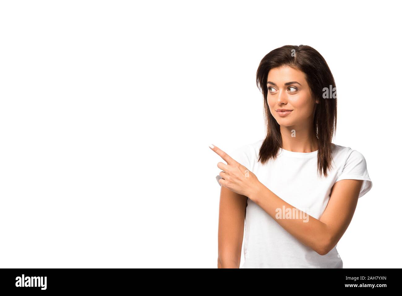 beautiful woman in white t-shirt pointing at something, isolated on ...