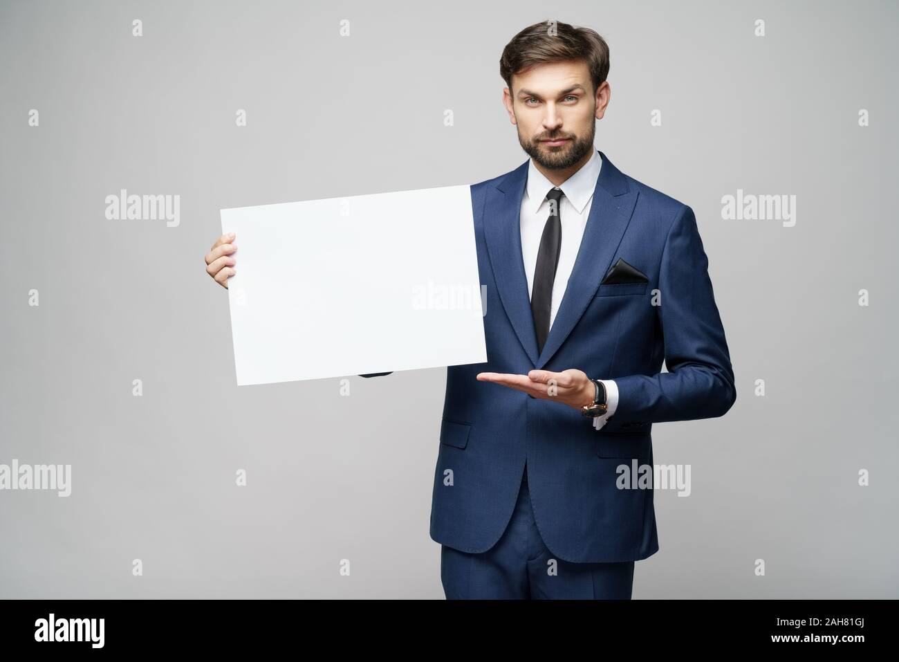 Young men holding signs hi-res stock photography and images - Alamy