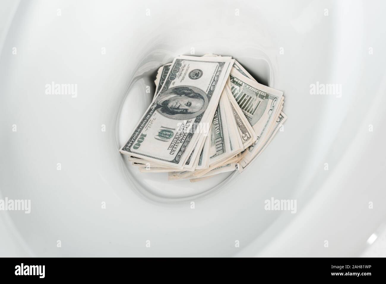 close up view of money in ceramic clean toilet bowl Stock Photo - Alamy
