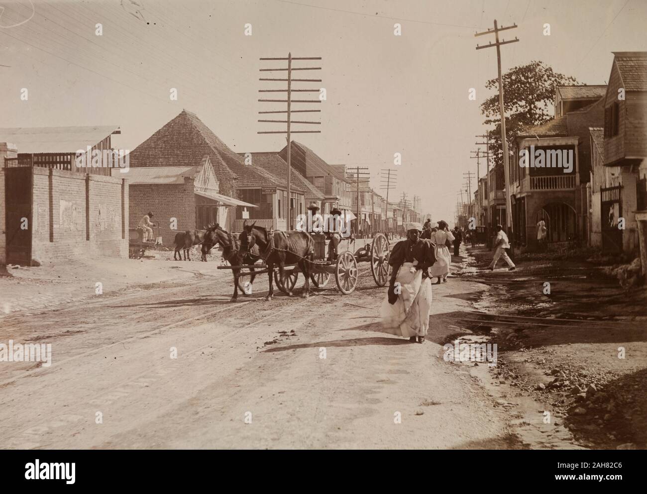 Jamaica, Rails laid down for mule-drawn trams criss-cross a busy road ...