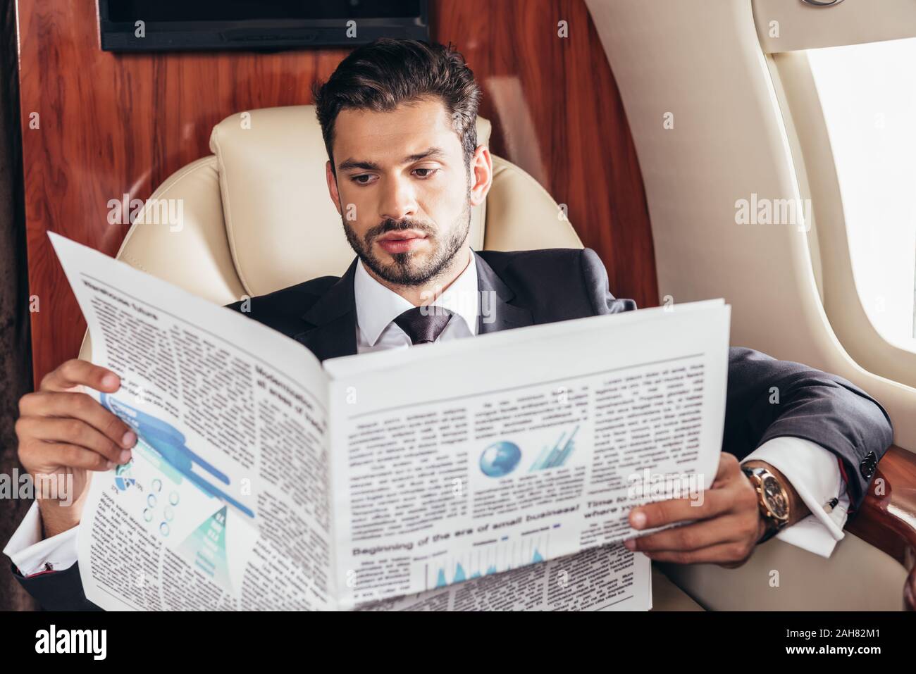 Read newspaper airplane hi-res stock photography and images - Alamy