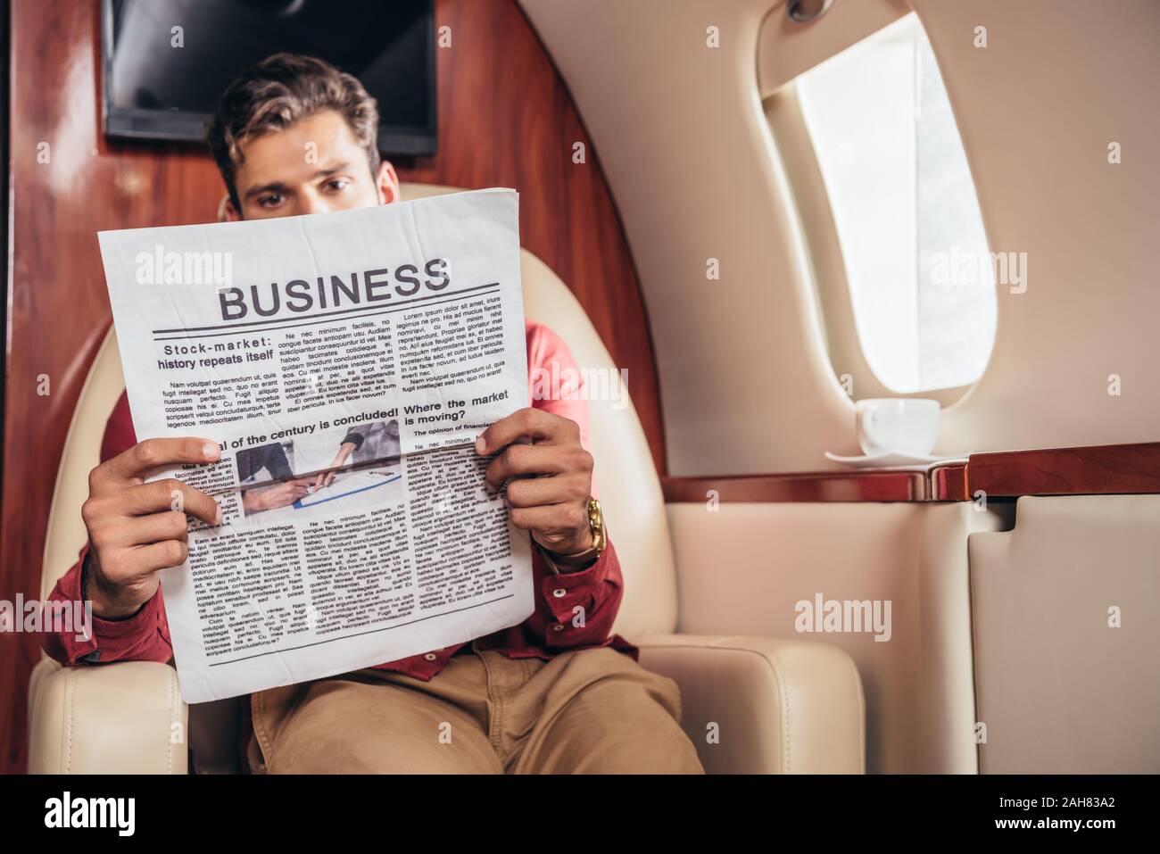 Read newspaper airplane hi-res stock photography and images - Alamy