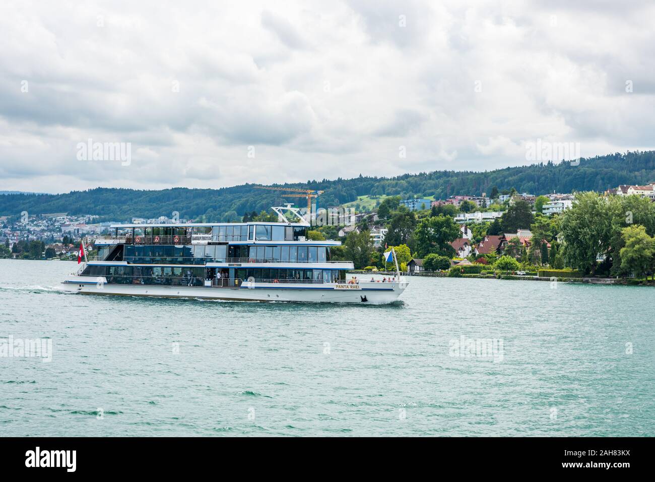 Cruise ship sailing on the lake of Zurich, with background of beautiful ...