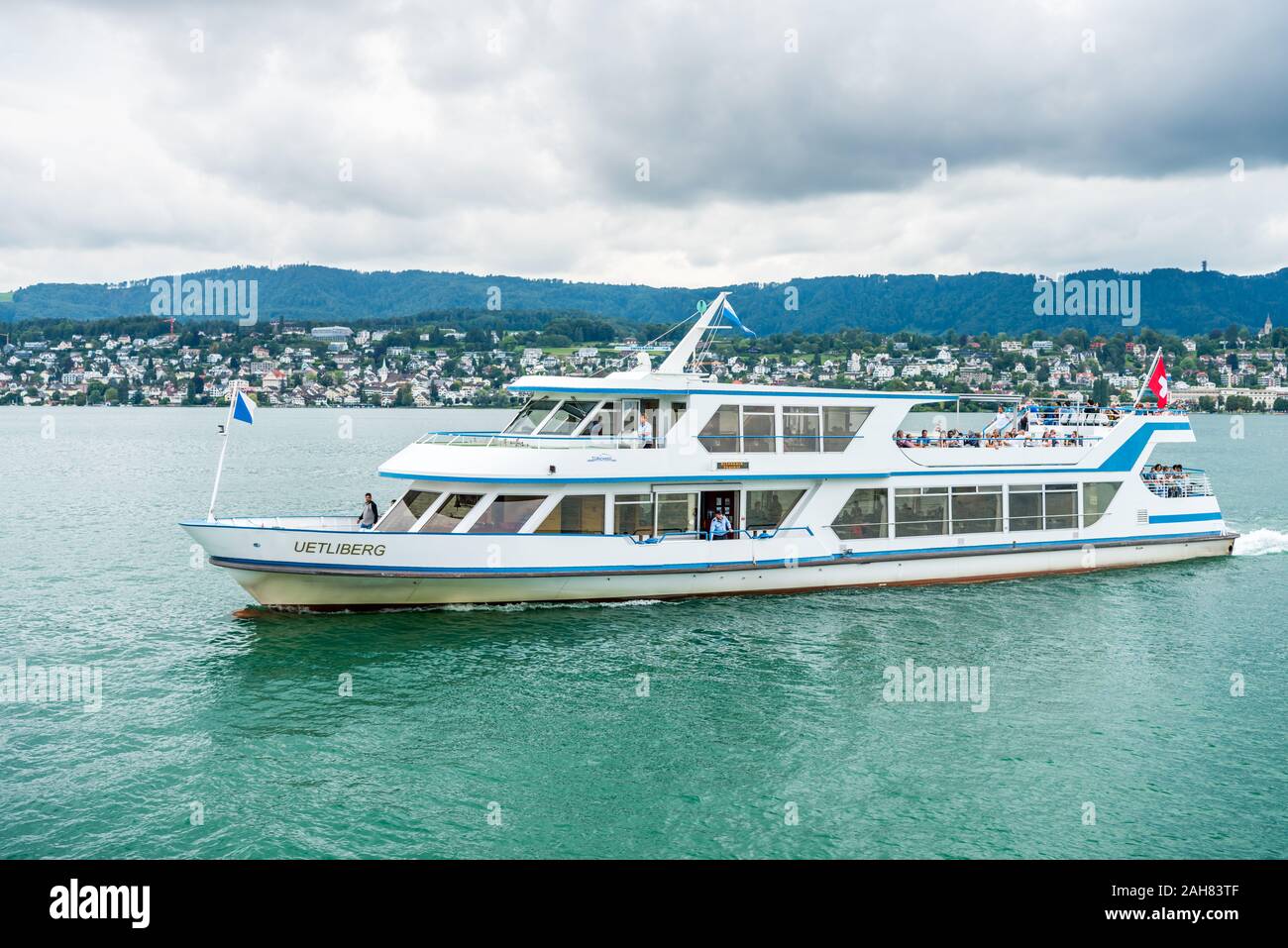 Cruise ship sailing on the lake of Zurich, with background of beautiful ...
