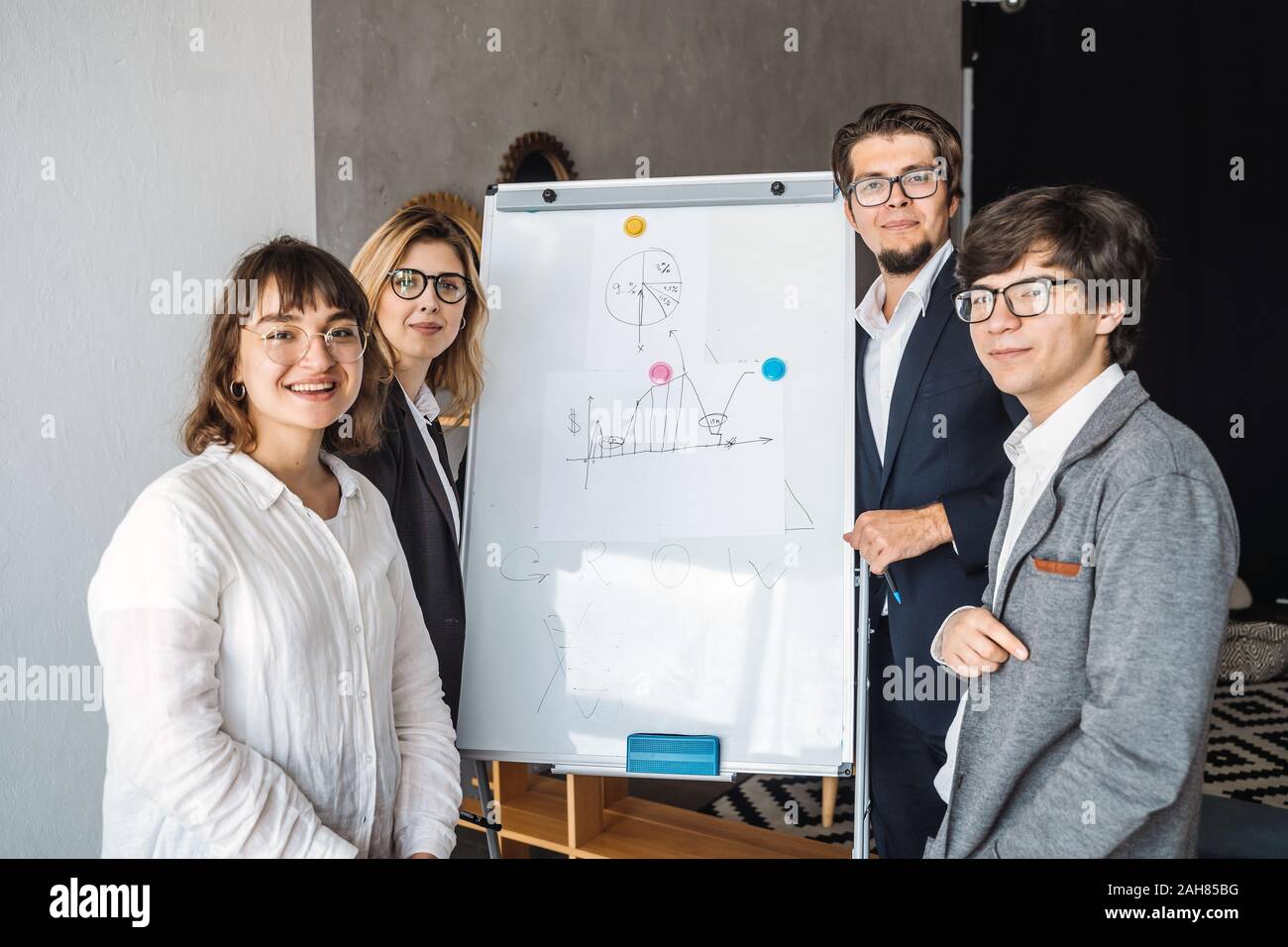 Businesspeople with whiteboard discussing strategy in a meeting Stock ...