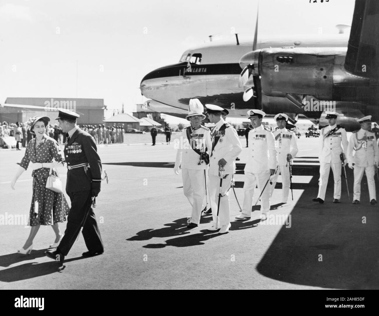Kenya, Princess Elizabeth walks away from the aircraft with a man in ...