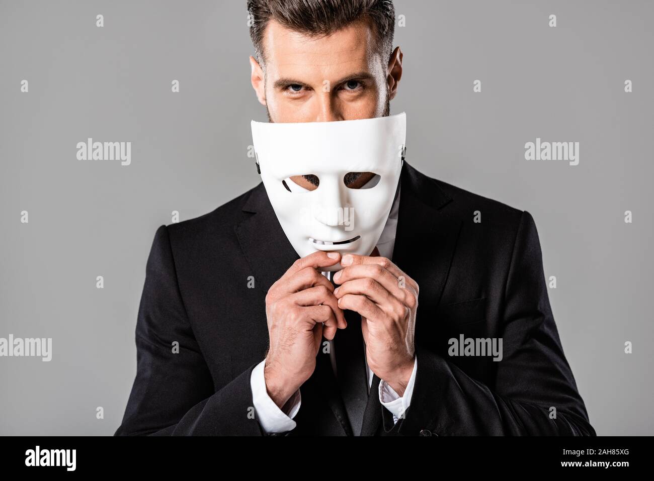 Businessman taking off tie hi-res stock photography and images - Alamy